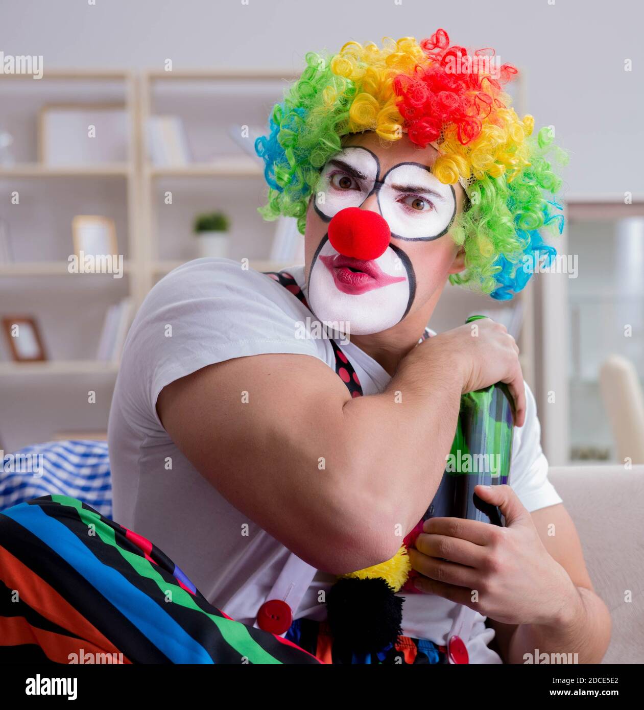 The drunk clown celebrating having a party at home Stock Photo - Alamy