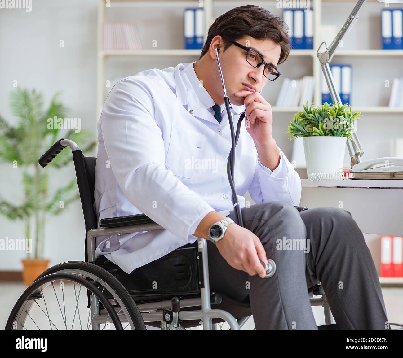 The disabled doctor on wheelchair working in hospital Stock Photo - Alamy