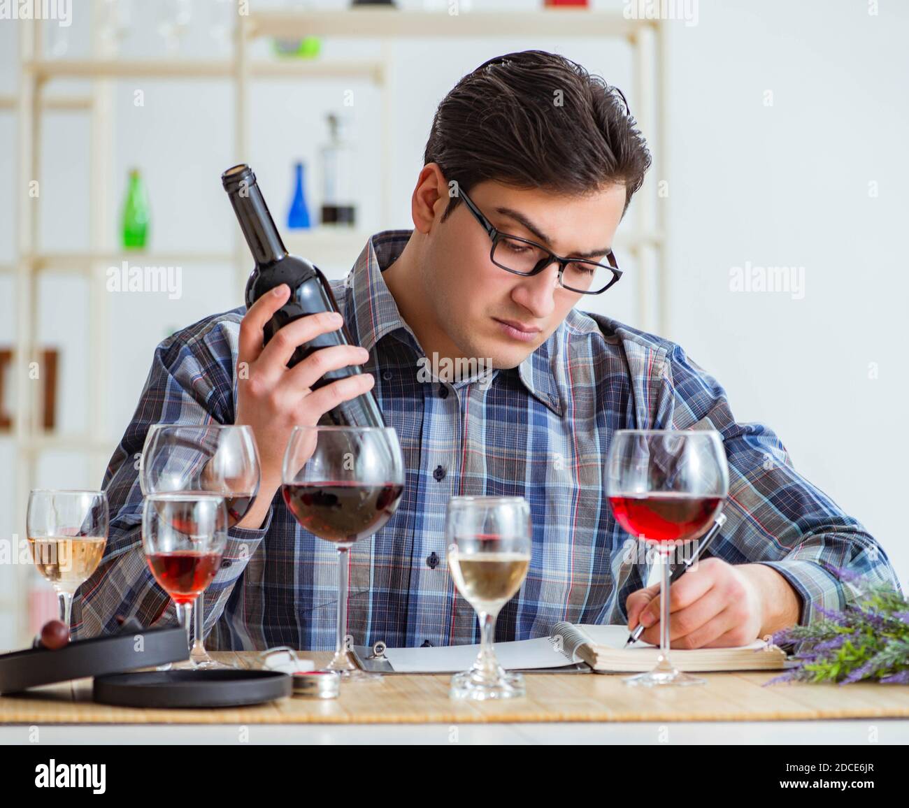 The professional sommelier tasting red wine Stock Photo - Alamy