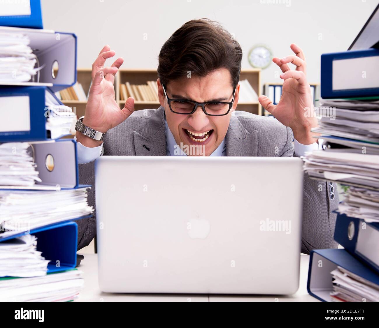 The busy businessman under stress due to excessive work Stock Photo - Alamy