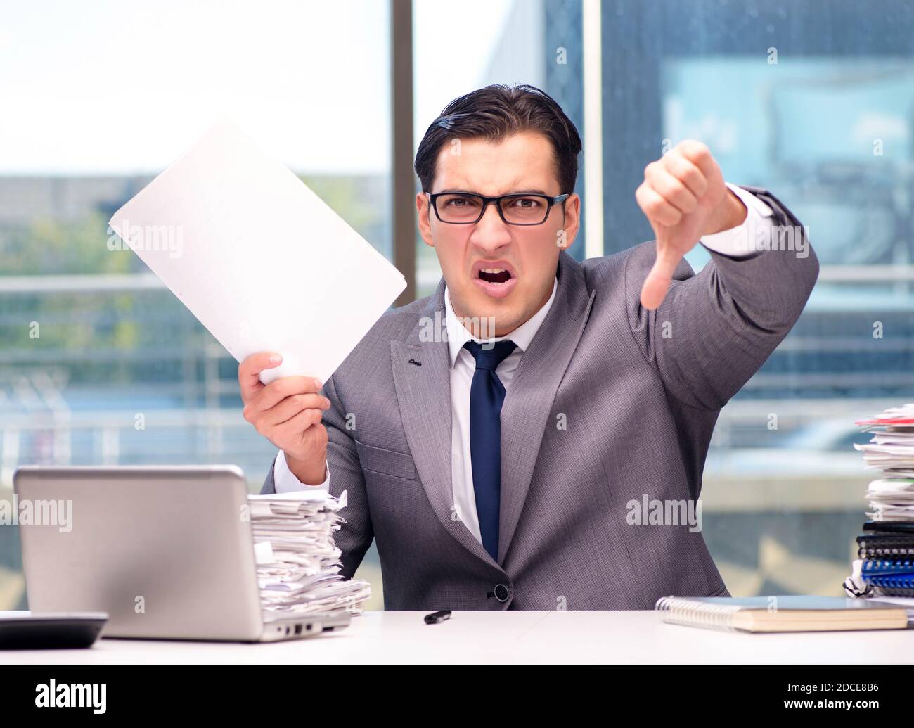 The angry businessman with too much work in office Stock Photo - Alamy