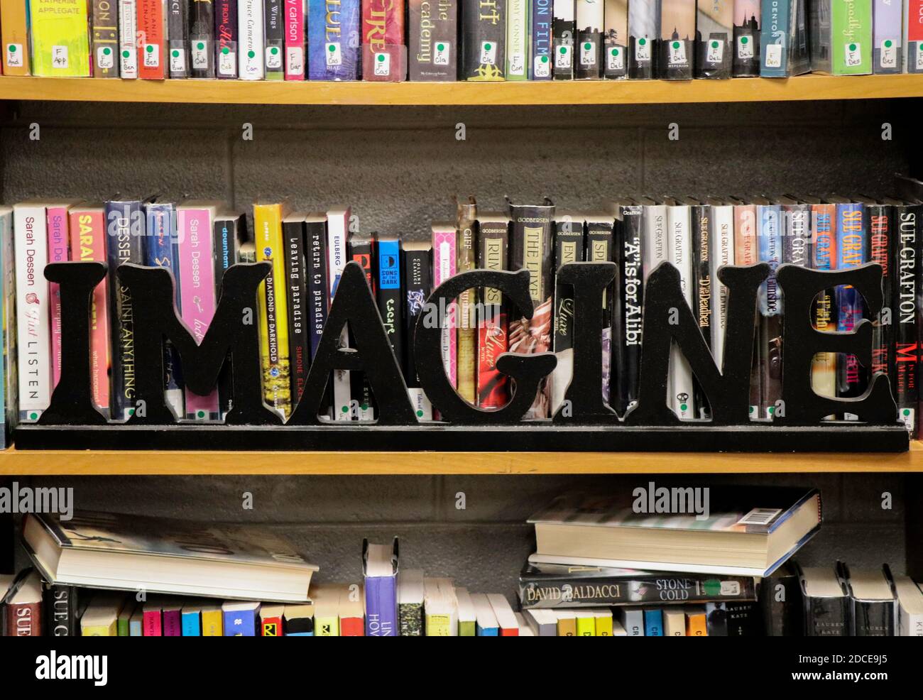 IMAGINE on a bookshelf in a library Stock Photo - Alamy