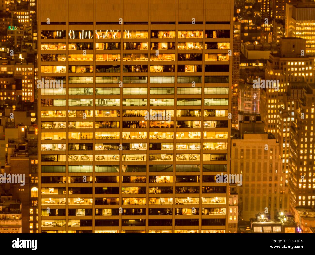 The office windows illuminated at night Stock Photo - Alamy