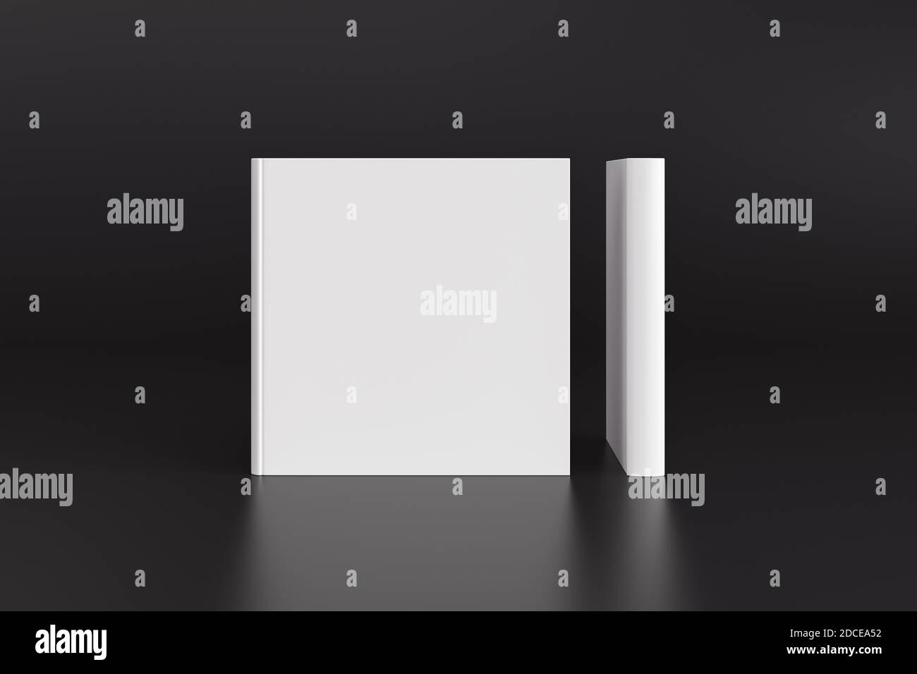 Two hardcover square white mockup books standing on the black ...