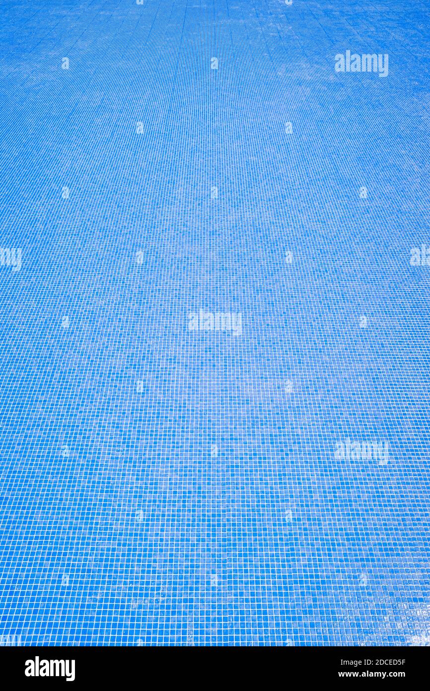 Bottom of an empty swimming pool with its square blue bricks Stock ...