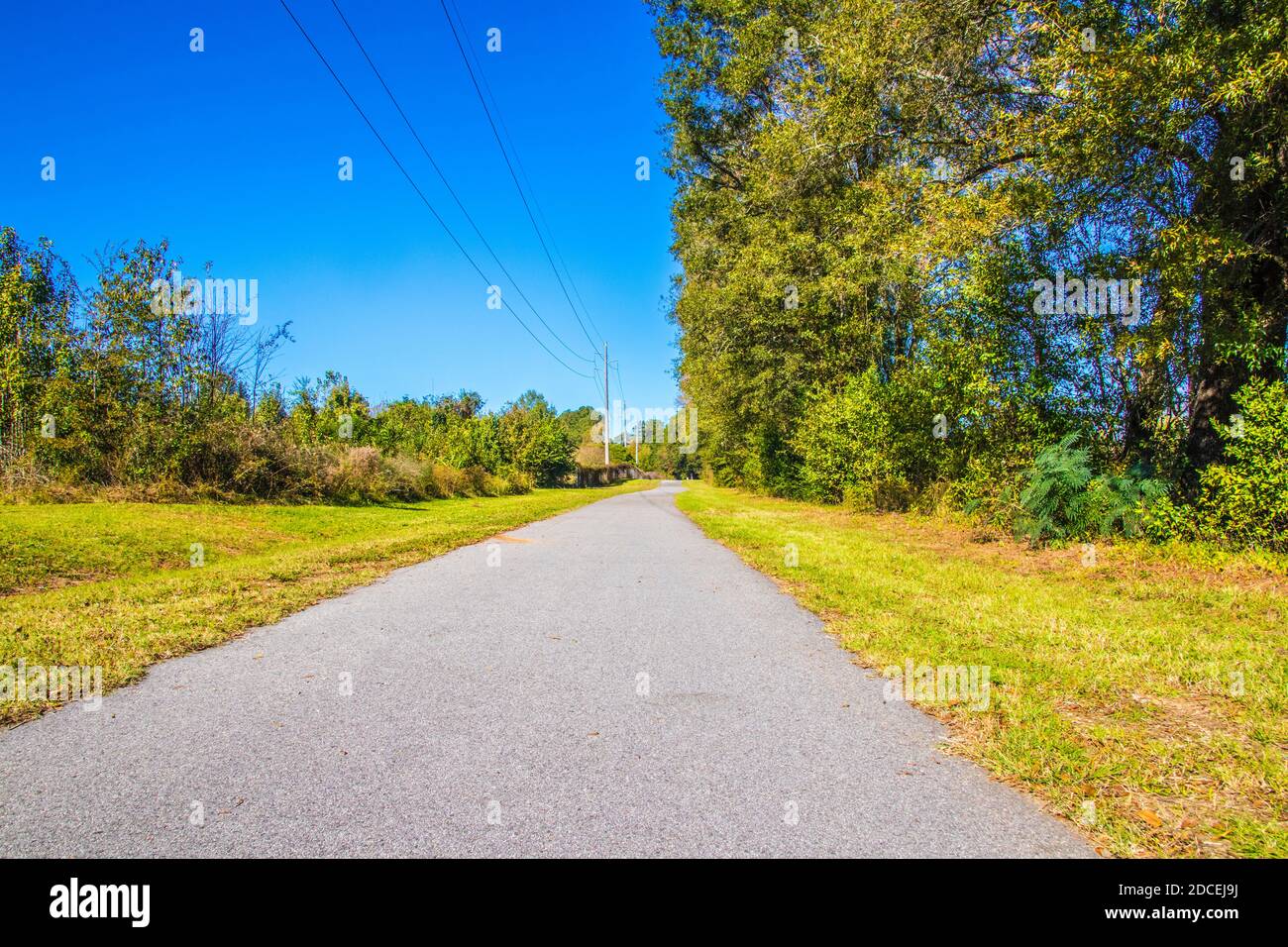 A paved walking path at the Augusta Canal in the Fall Stock Photo - Alamy
