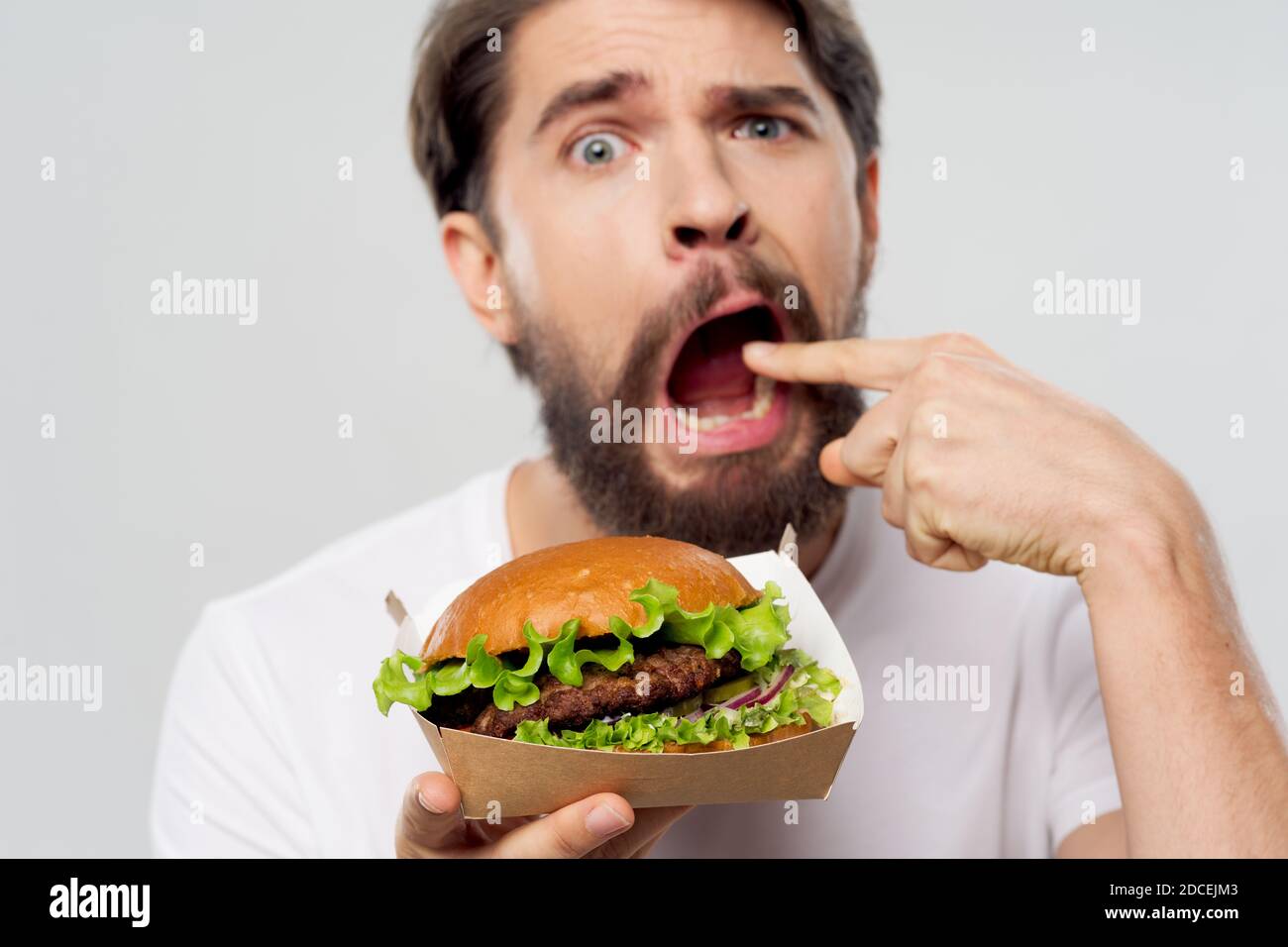 Man eating sandwich dirty hands hi-res stock photography and images - Alamy