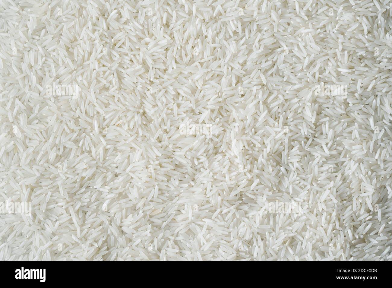 White rice grains pattern background close-up Stock Photo - Alamy
