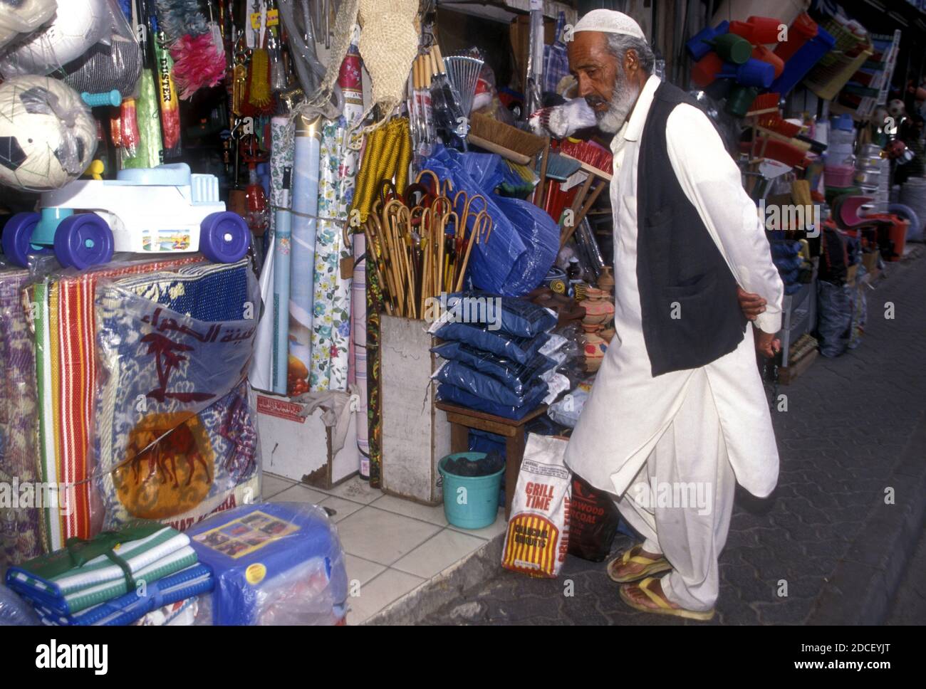 Muslim worker in Oman shopping for eid gifts for his children back in ...