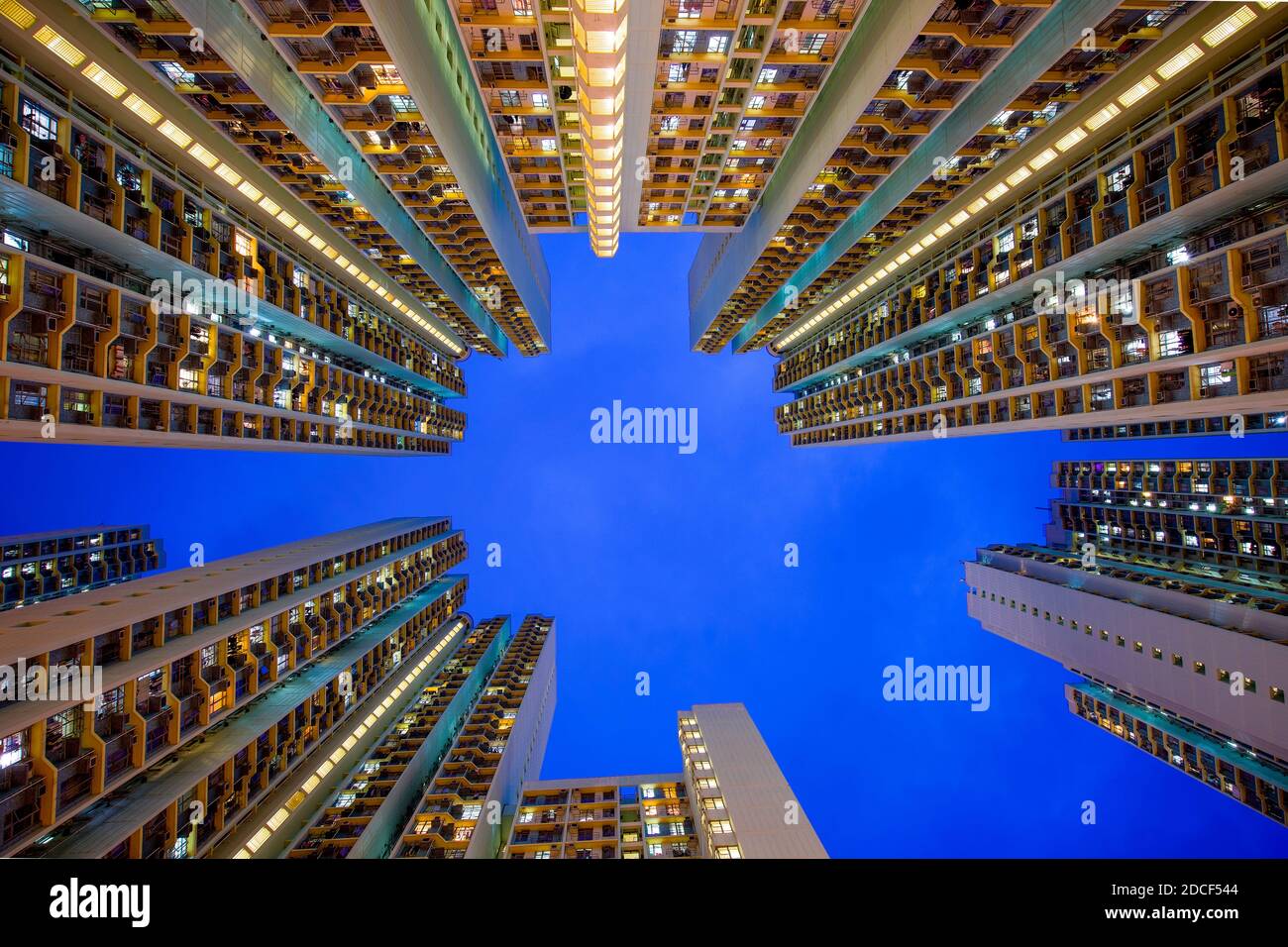 Apartment buildings in evening lights in windows hi-res stock ...