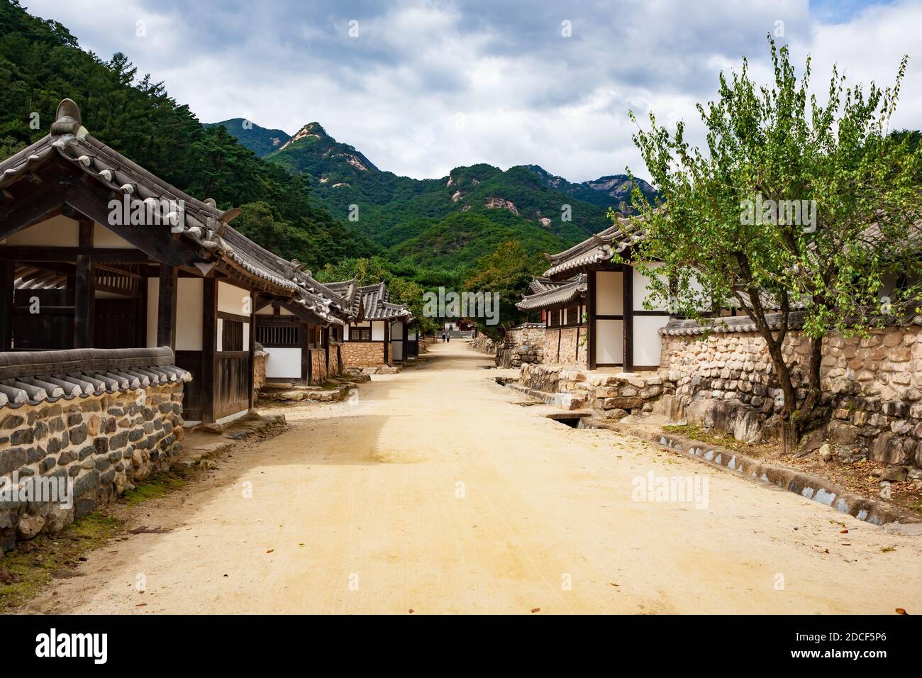 Landscape of Korean traditional buildings, trees, mountains, stones ...