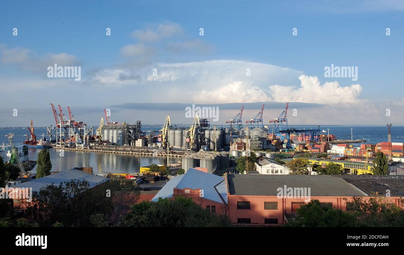 Port harbor with grain elevator terminal and red warehouse building ...