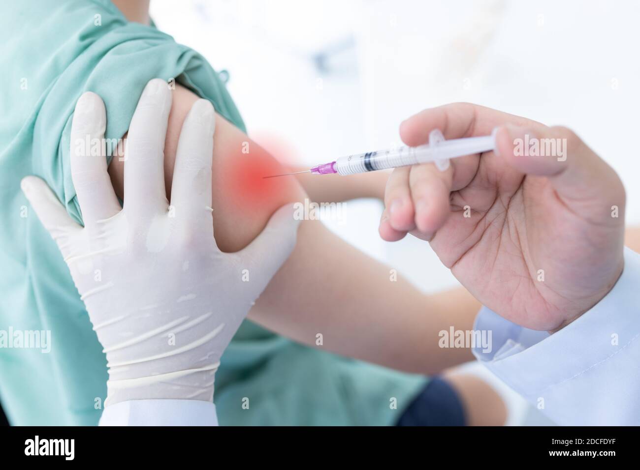 Close up Doctor making a vaccination in the shoulder of patient, Flu ...