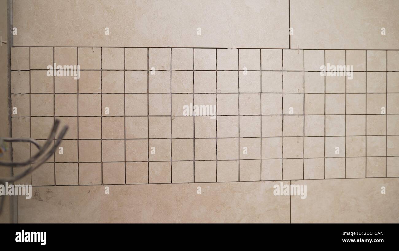 Large new tiles in the bathroom. Fresh tiles in the bathroom ...