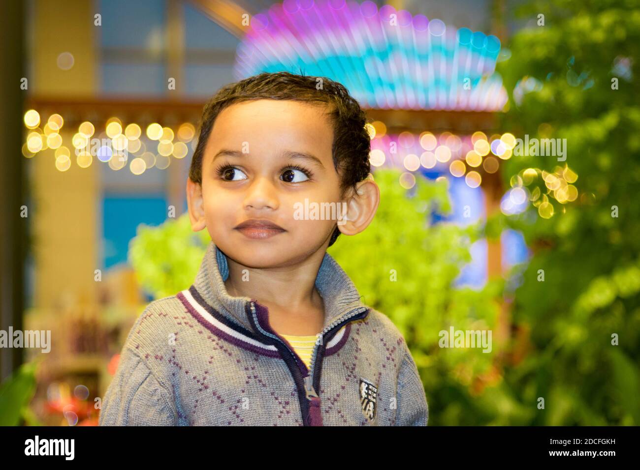 Smiling kid portrait with bokeh capture Stock Photo - Alamy
