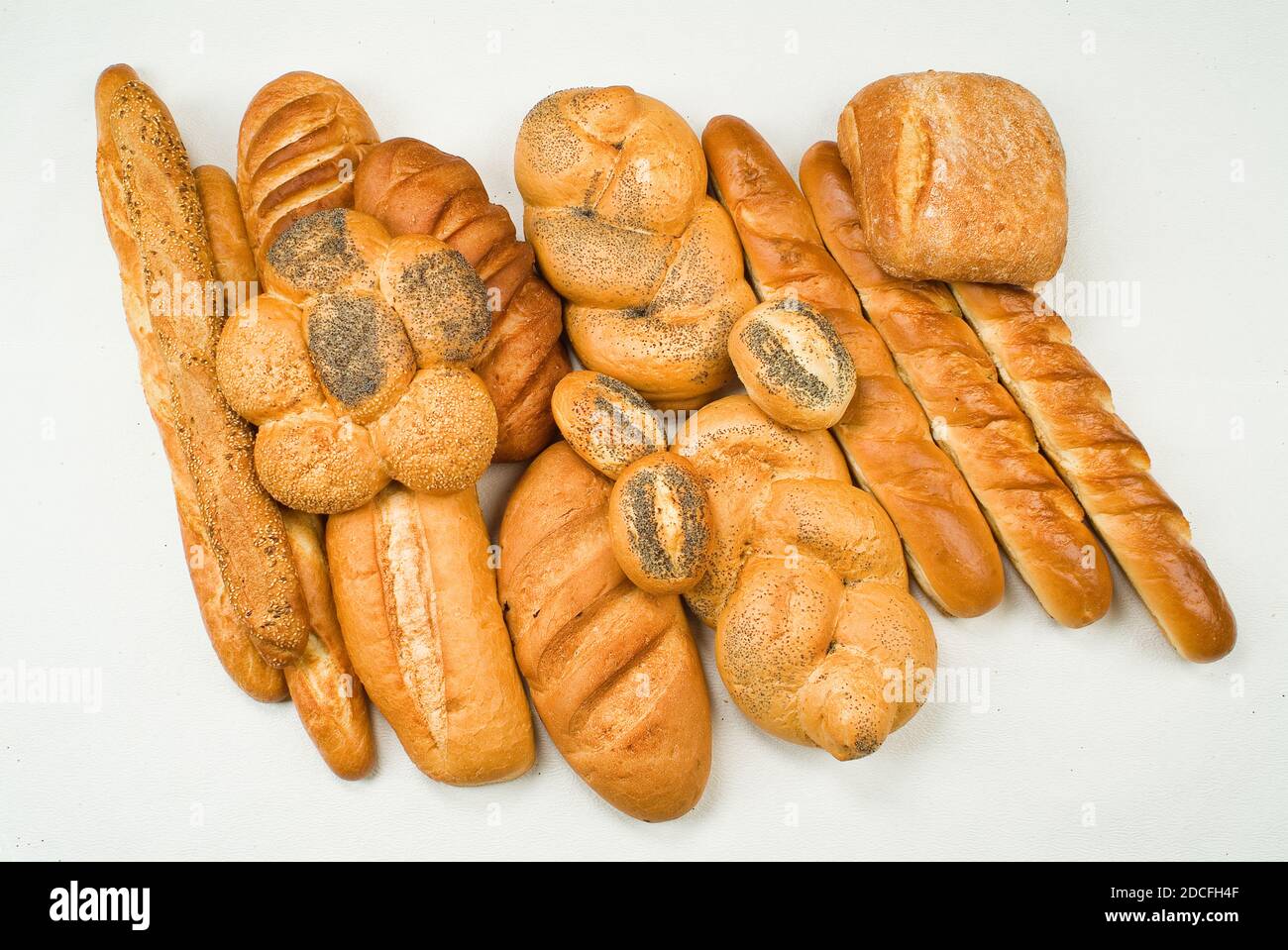 Different kinds of bread on a studio background Stock Photo - Alamy