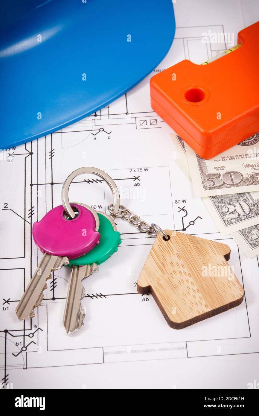 House keys, currencies dollar, electrical construction diagrams or ...