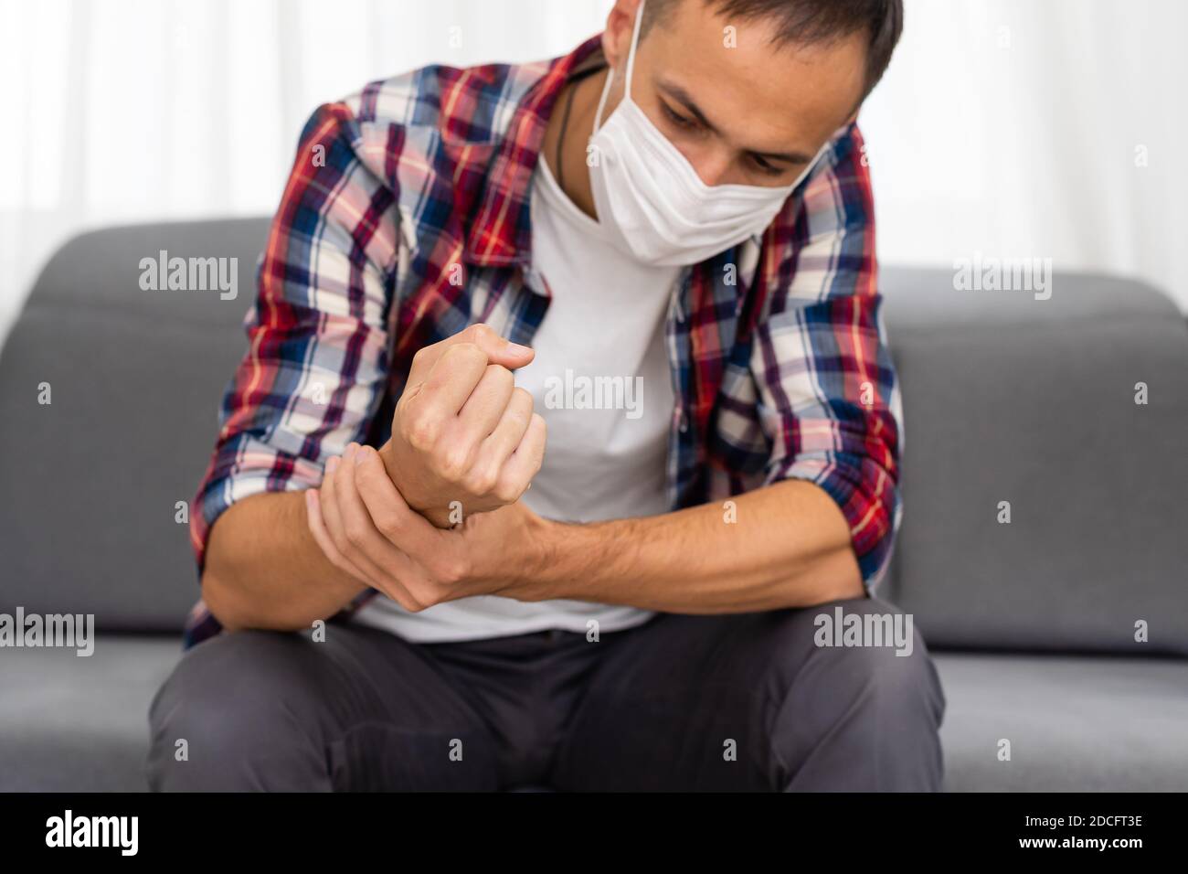 Caucasian handsome man wear masks and hold hand on his chest ...