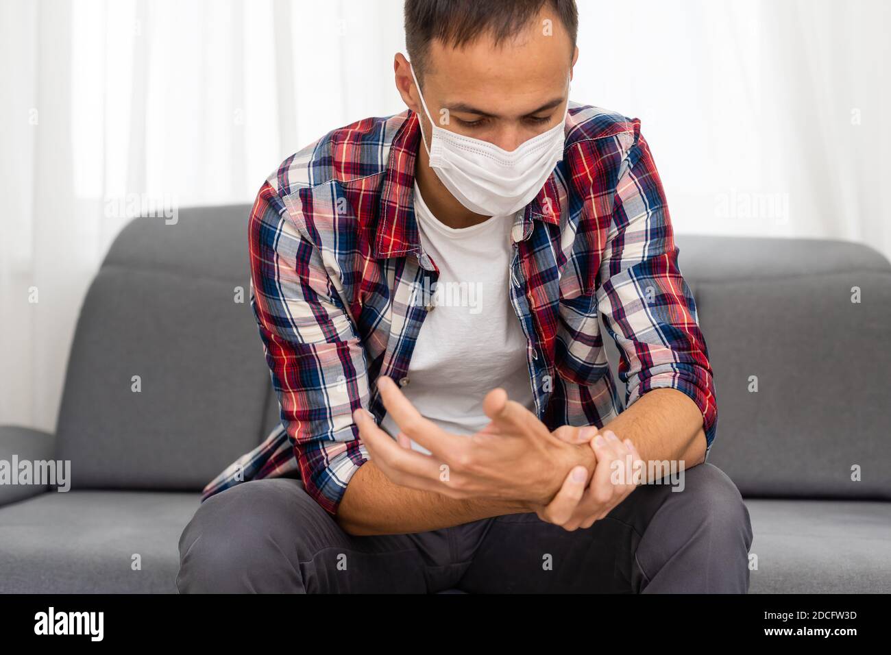 Caucasian handsome man wear masks and hold hand on his chest ...