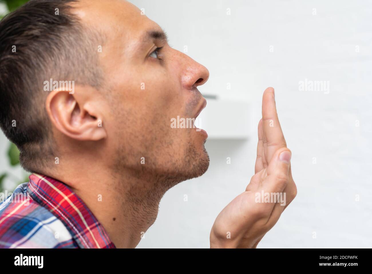 Headshot of smell something bad face man Stock Photo - Alamy