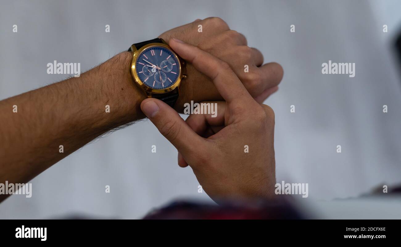 Person using wristwatch for business and work Stock Photo - Alamy