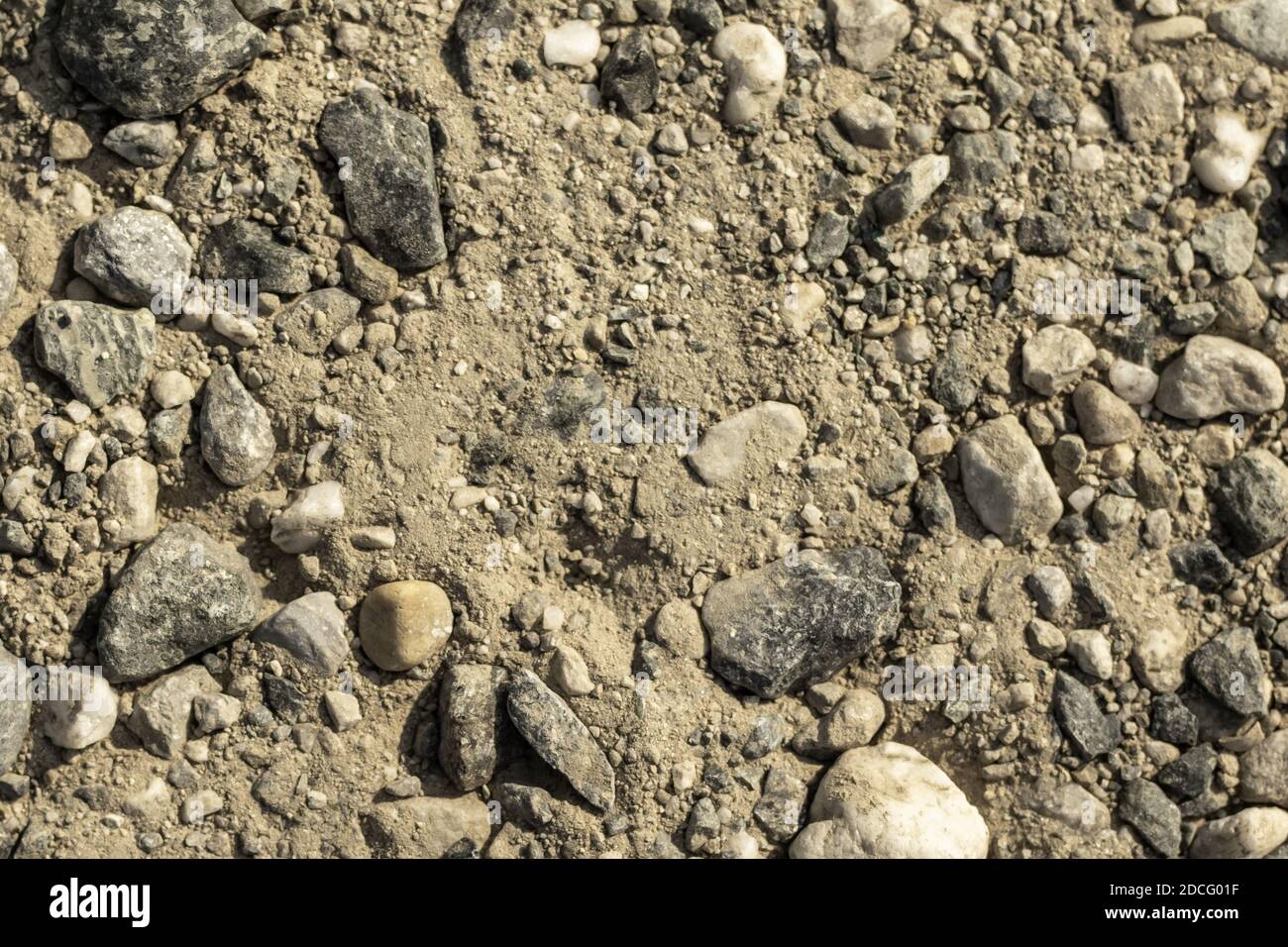 background of stones of various sizes and scattered colors Stock Photo ...