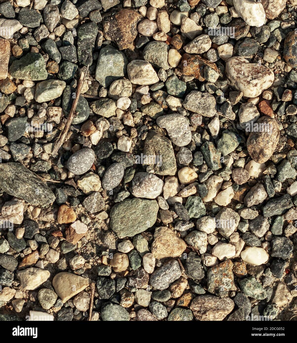 background of stones of various sizes and scattered colors Stock Photo ...