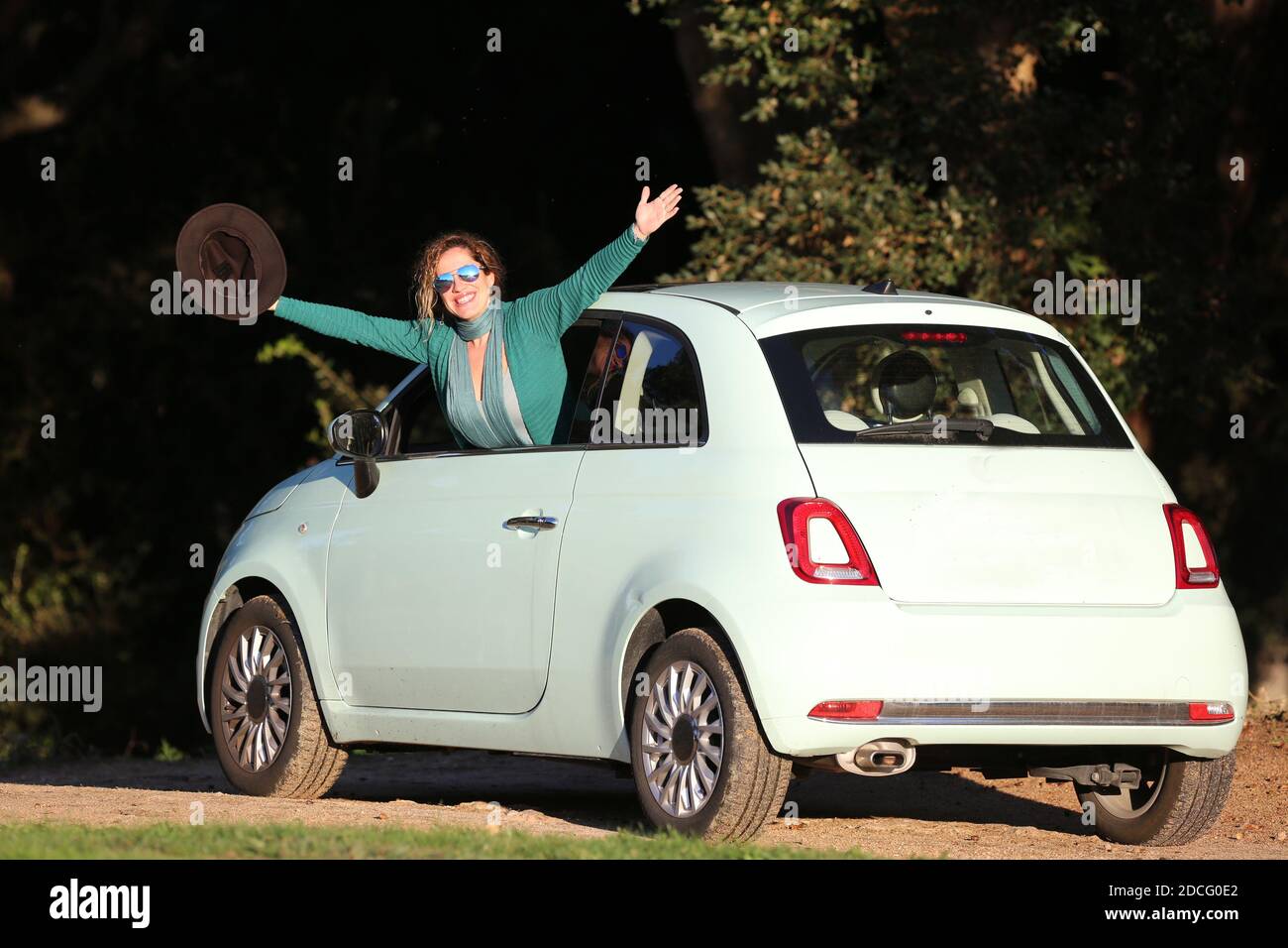 woman outside the windows car with open arms Stock Photo - Alamy