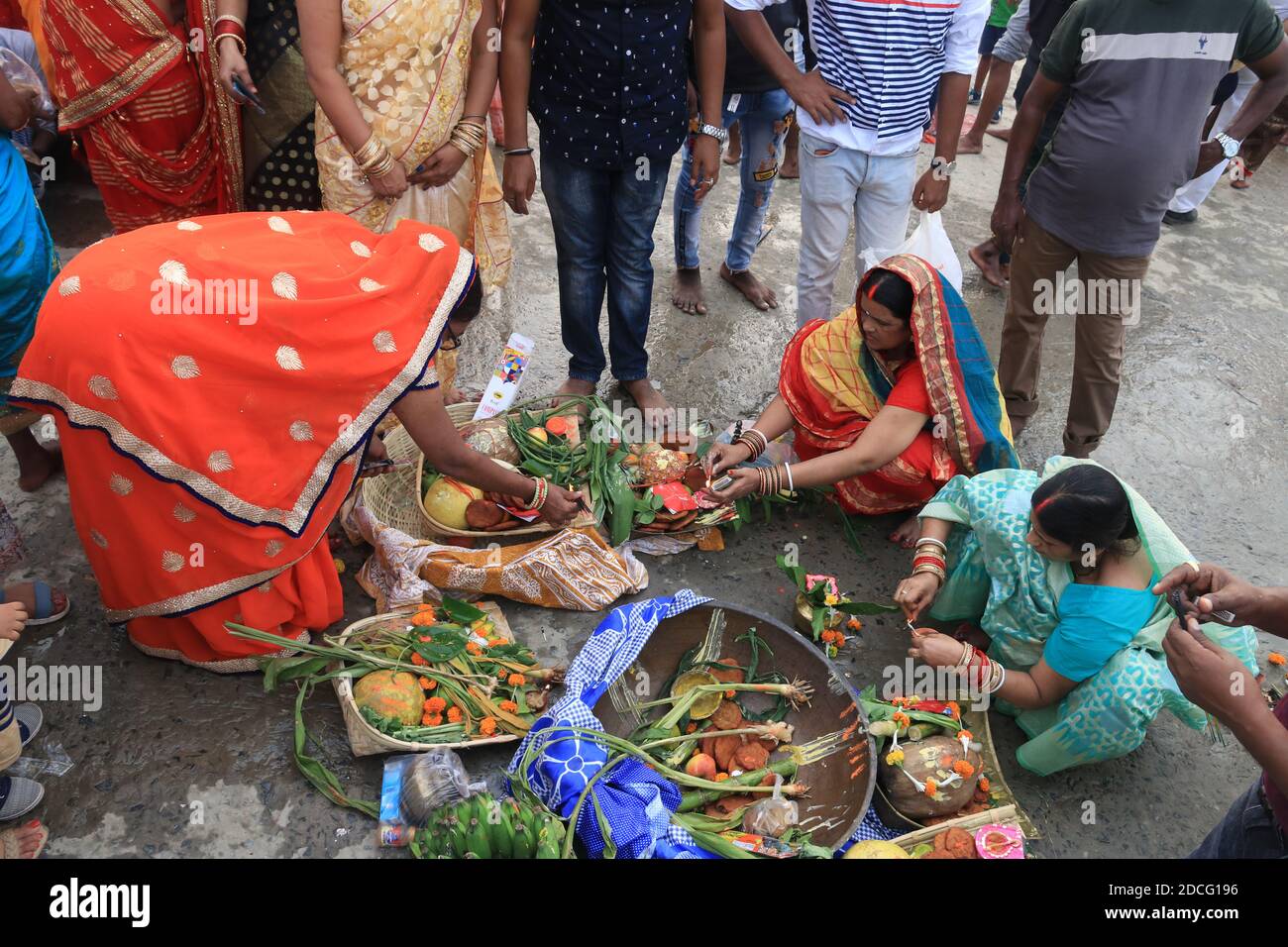 Hindu devotees worship the Sun god on the banks of the Ganges River ...