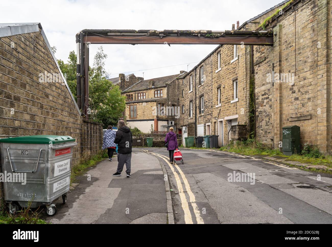 man framed by elevated piping, slaithwaite, west yorkshire Stock Photo ...