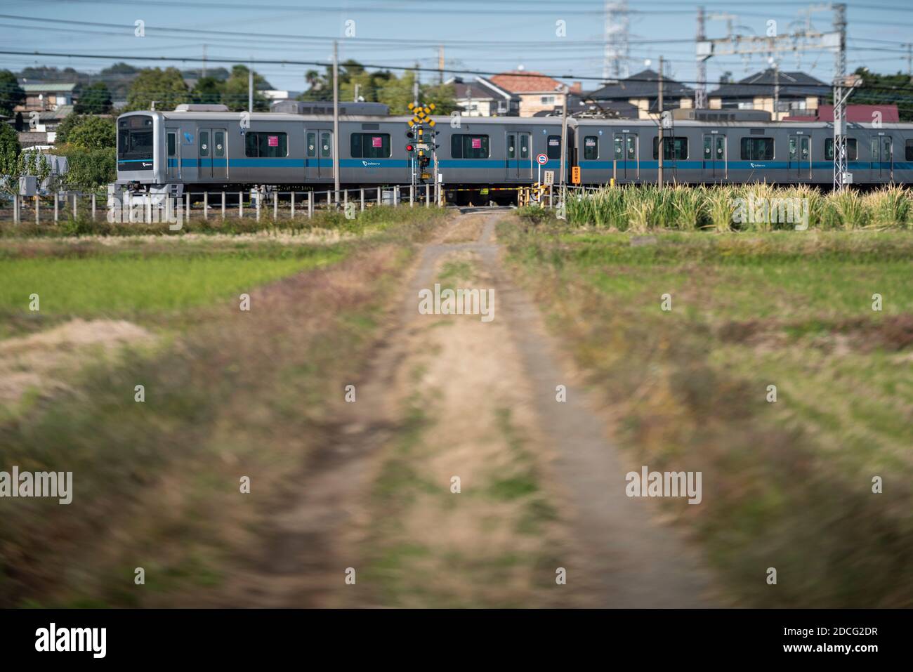 Odakyu Line passing through railroad crossing, Isehara City, Kanagawa ...