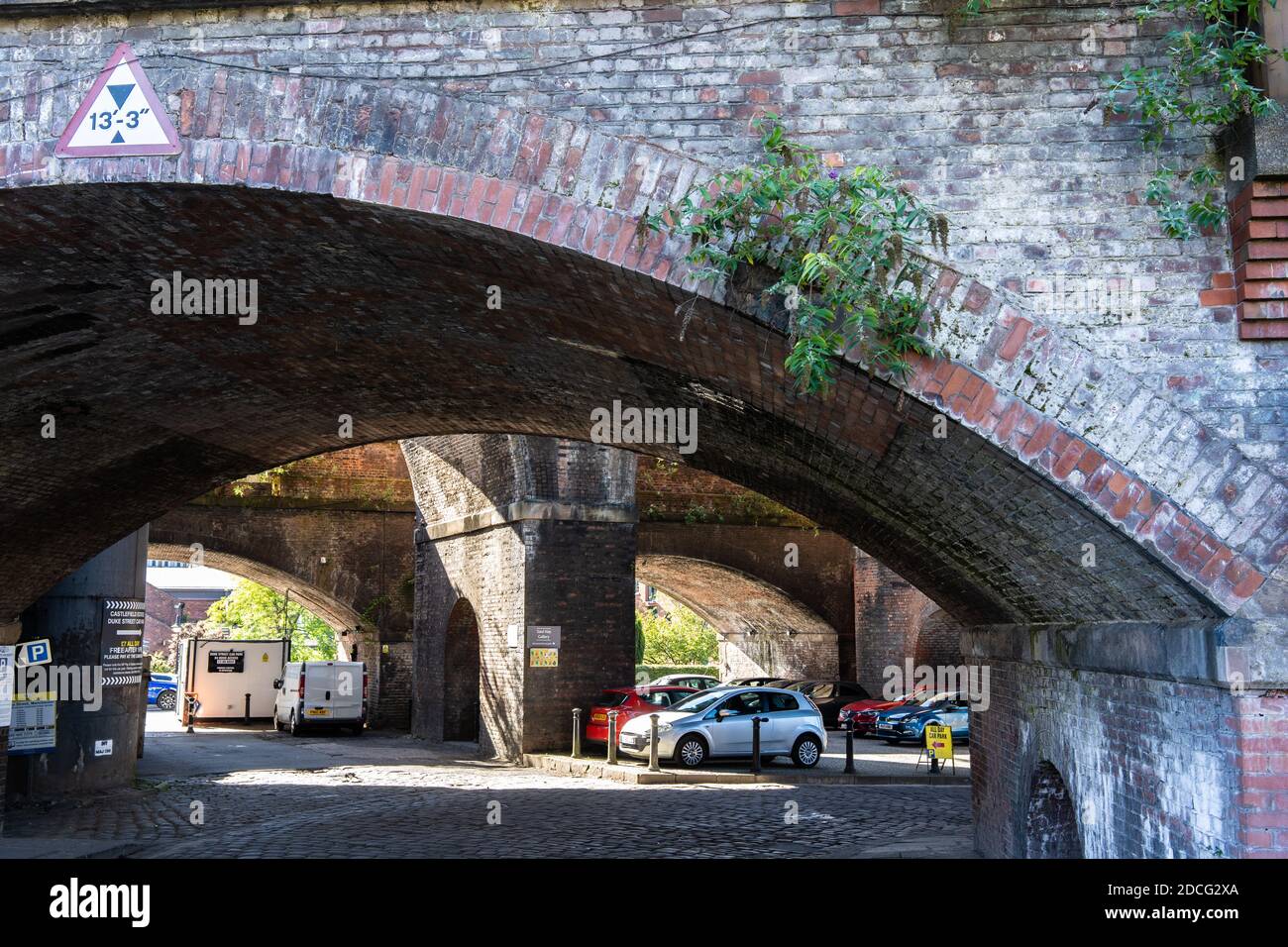car park under railway arches, castlefield, manchester Stock Photo - Alamy