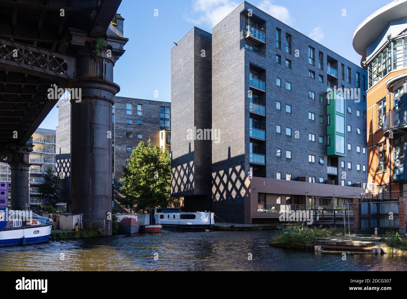 modern buildings and victorian railway bridges, castlefield, manchester ...
