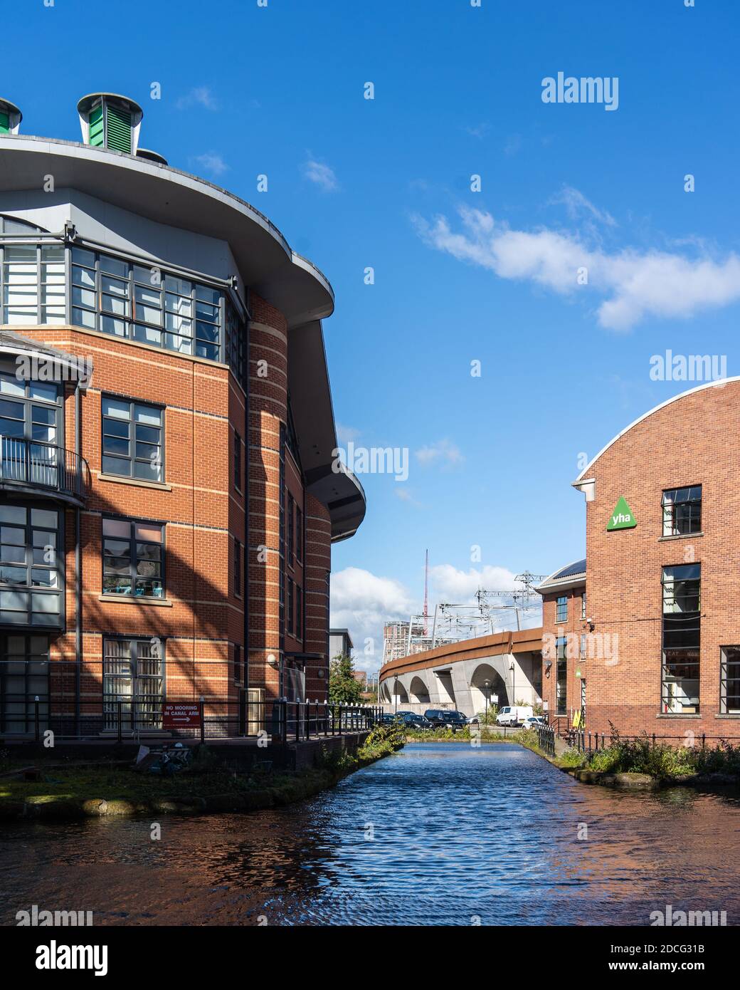 brick buildings and distant railway arches, castlefield, manchester u.k ...