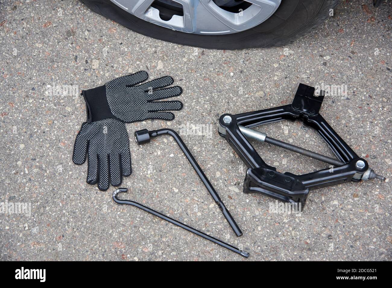 Flat tire of a passenger car, wheel replacement tools, trouble on the ...