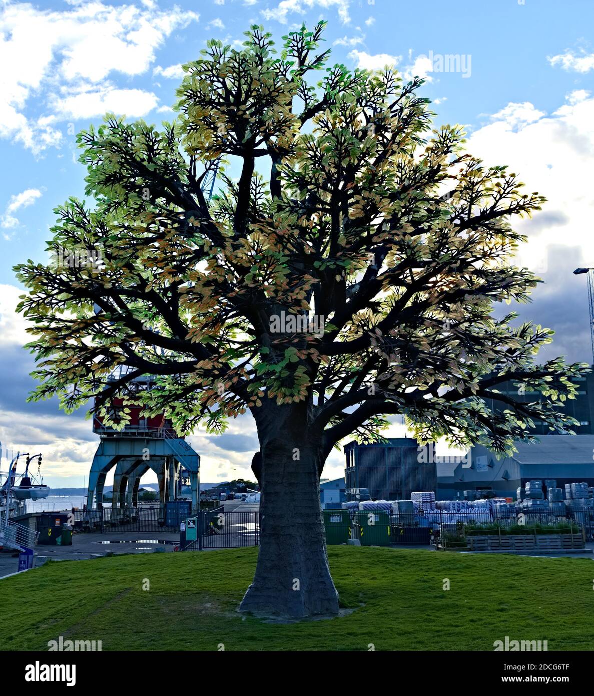 Large artificial plastic tree with leaves lit by LEDs Stock Photo - Alamy