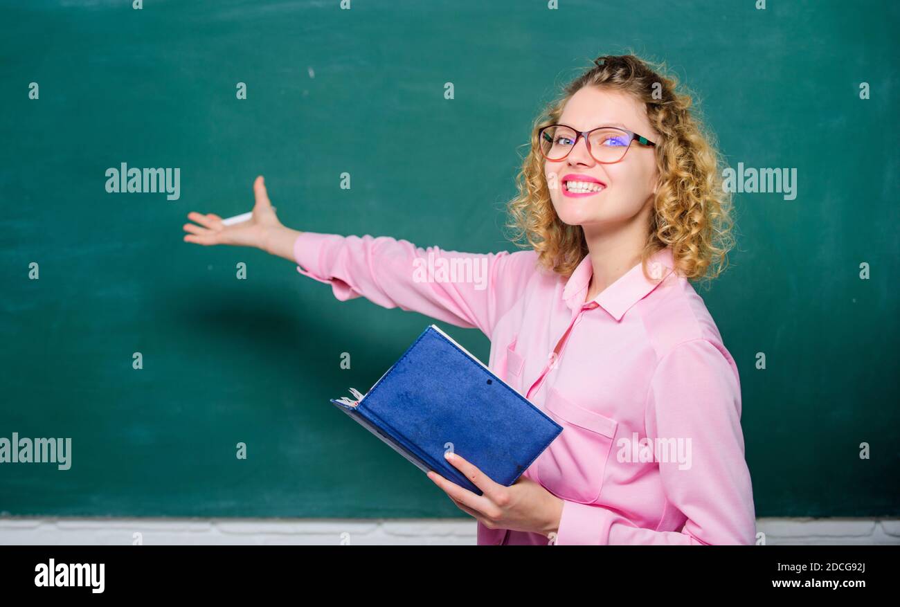 Pedagogue hold book and explaining information. Teacher explain hard ...