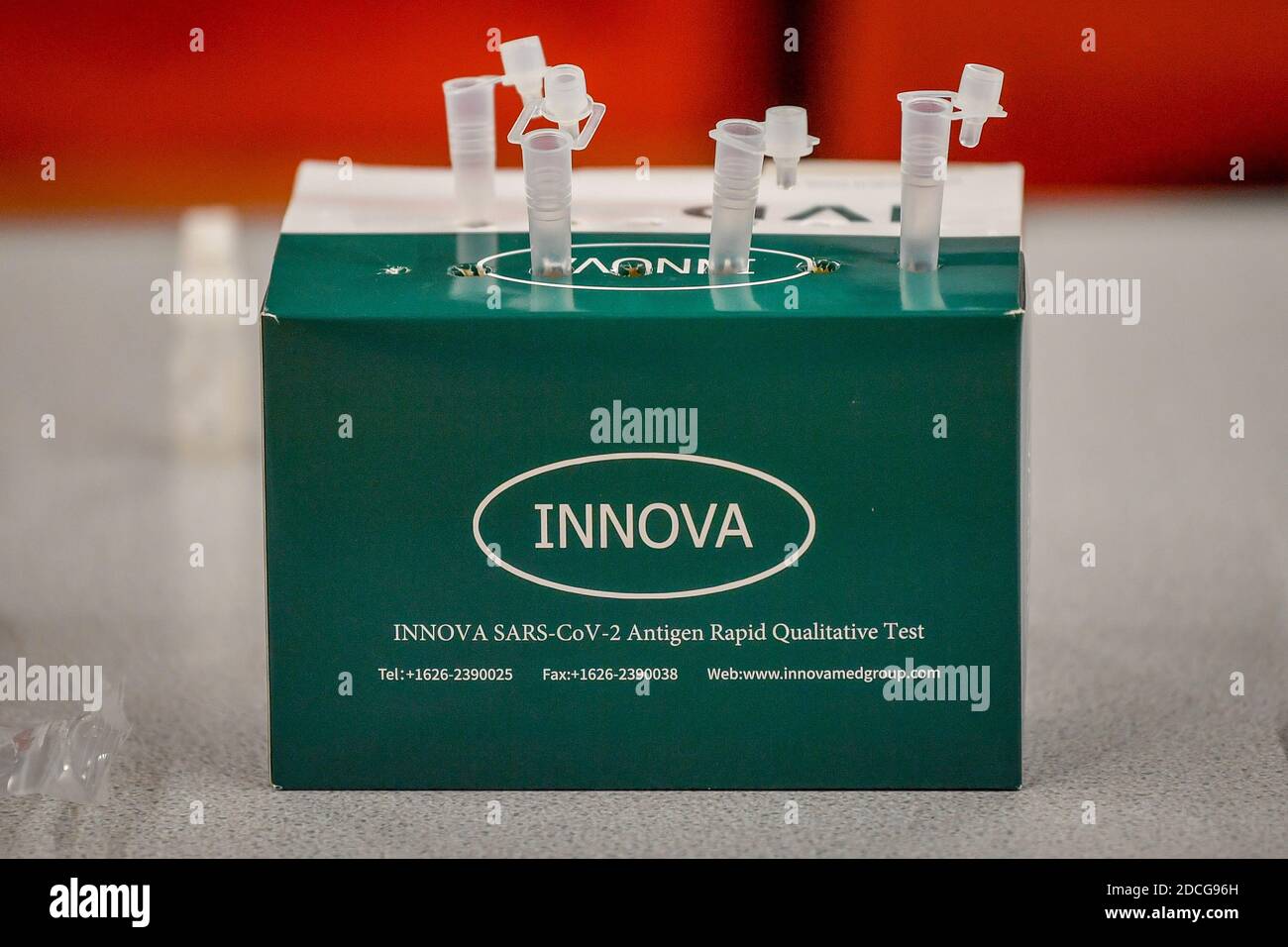 Fluid vials are readied poked into a box containing lateral flow ...