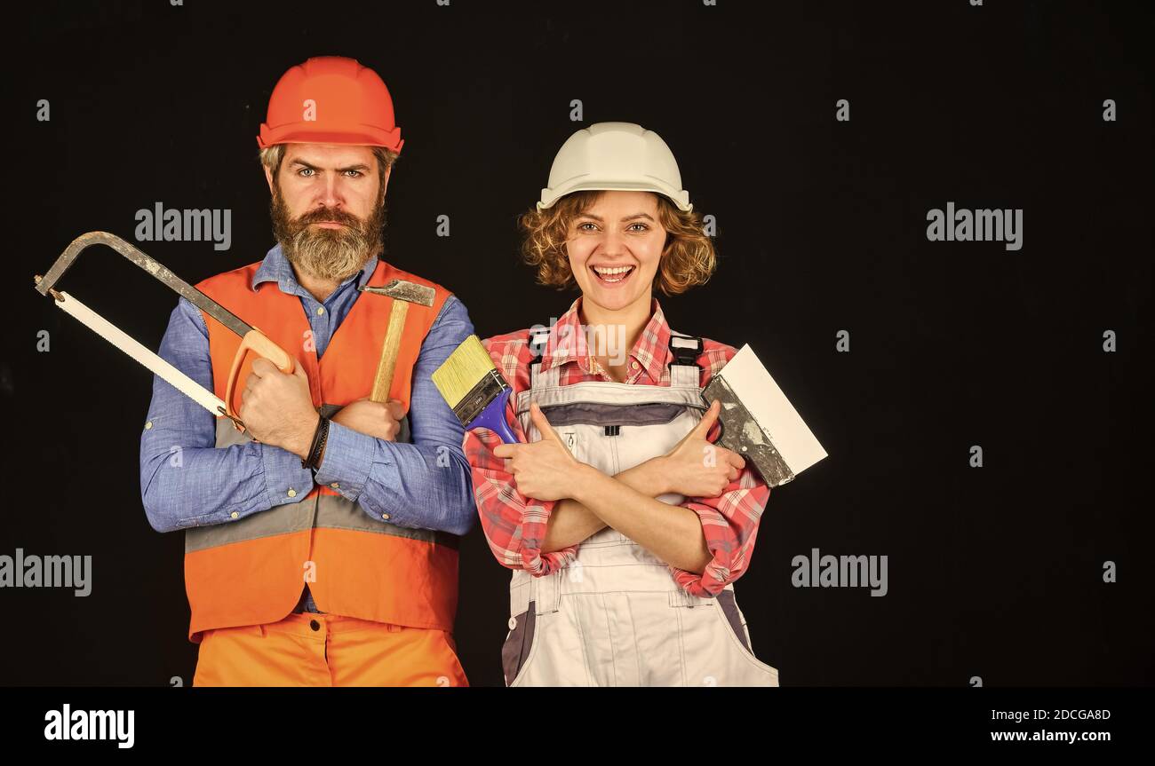 imagine their new house. Portrait of confident handyman and his female ...