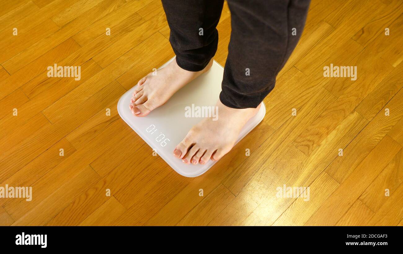 Overweight man scale hi-res stock photography and images - Alamy