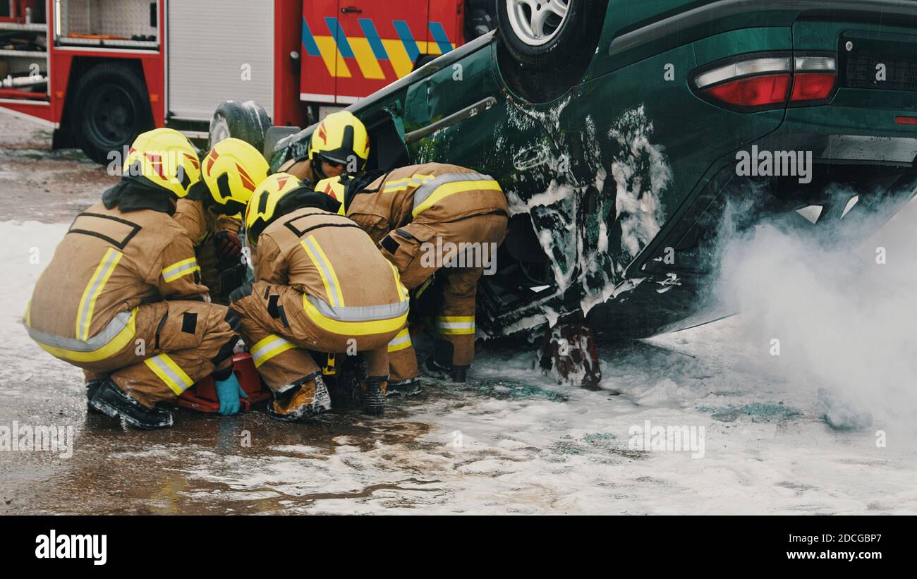 Firefighters rescuing people hi-res stock photography and images - Alamy