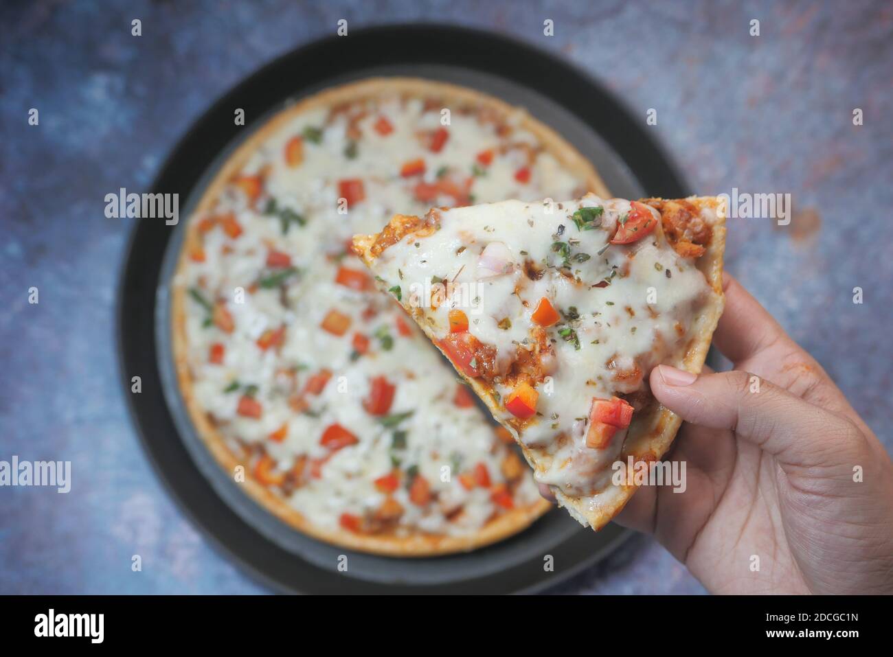 Hand pizza slice close up hi-res stock photography and images - Alamy