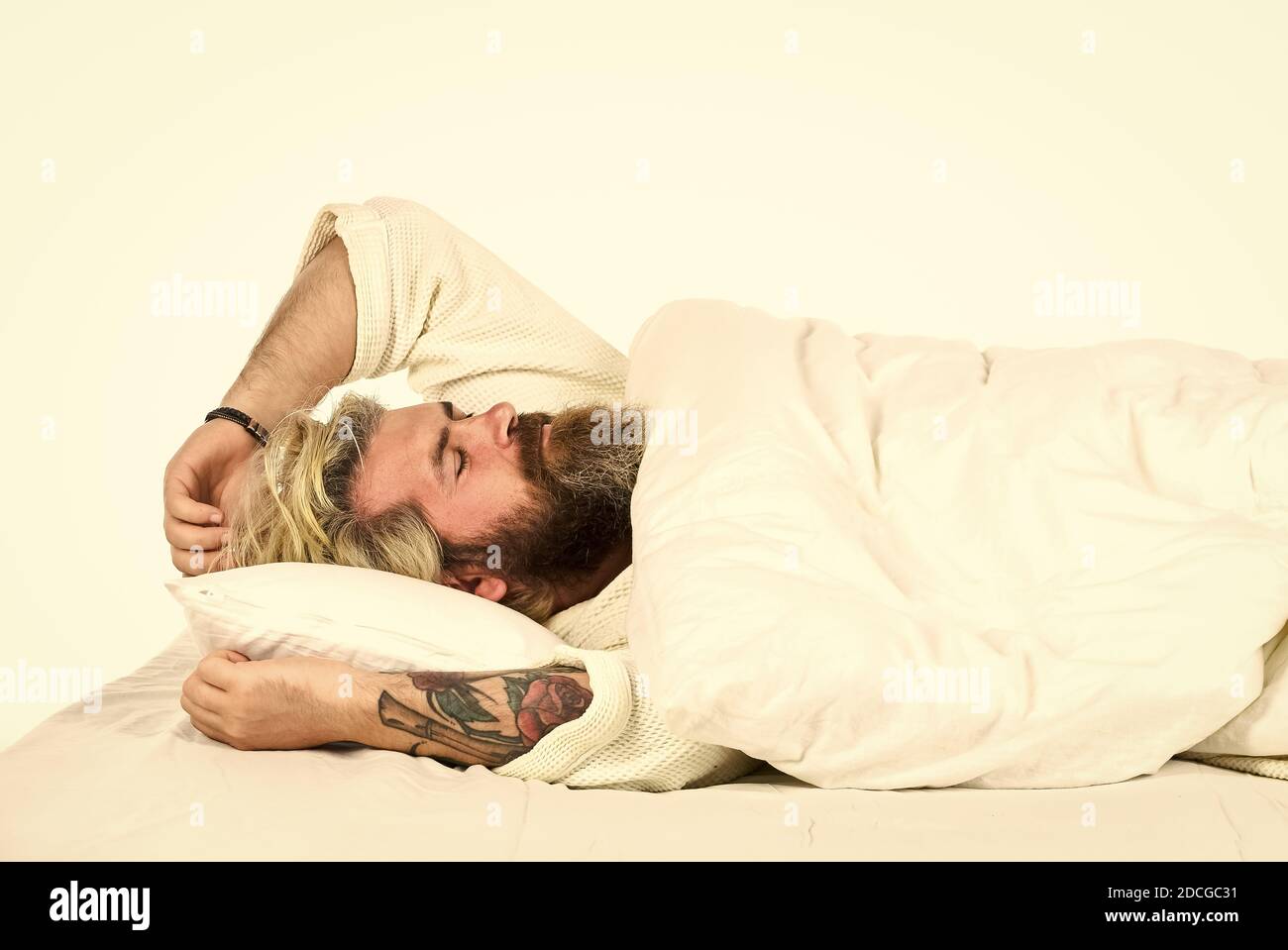 Practice relaxing bedtime ritual. Man with sleepy face lay on pillow ...