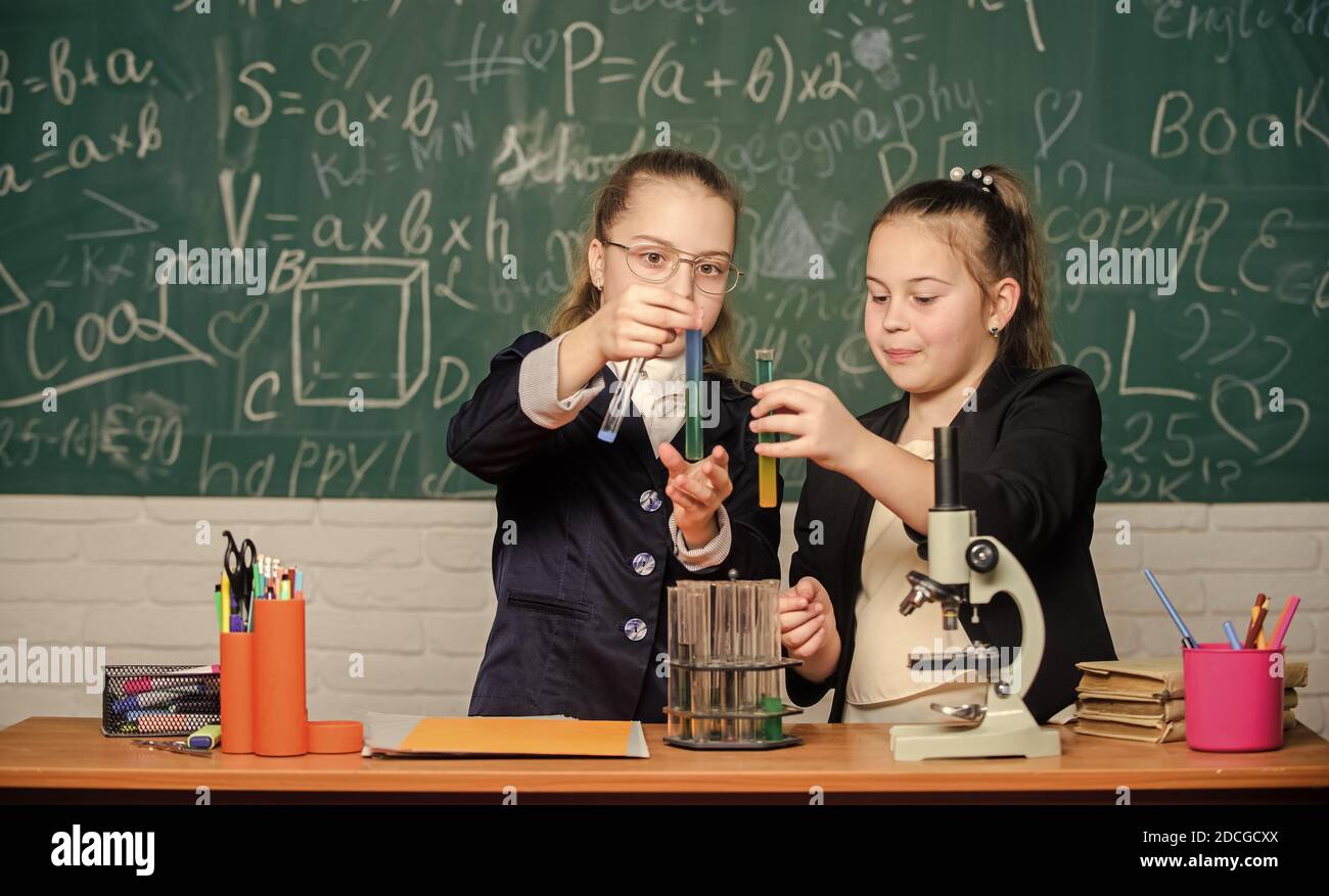science experiments in laboratory. Little girls scientist with ...