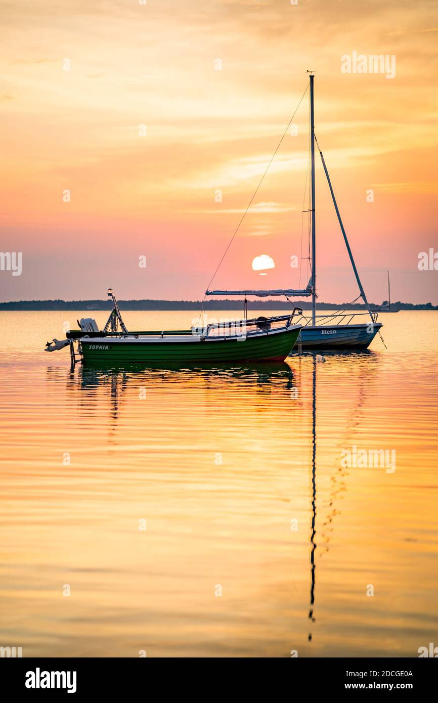 boats on lake during sunset Stock Photo - Alamy