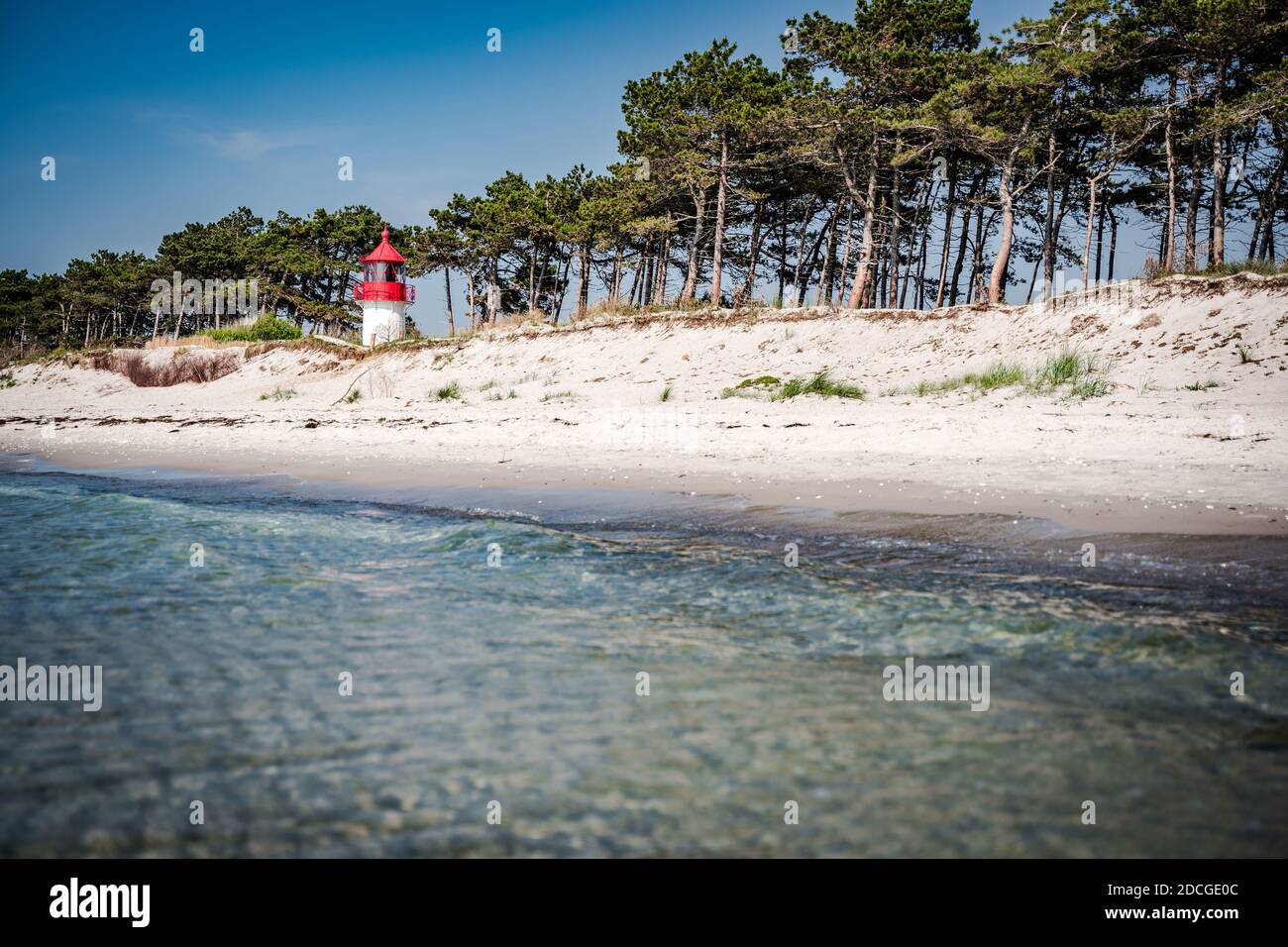 white sand beach with lighthouse Stock Photo - Alamy