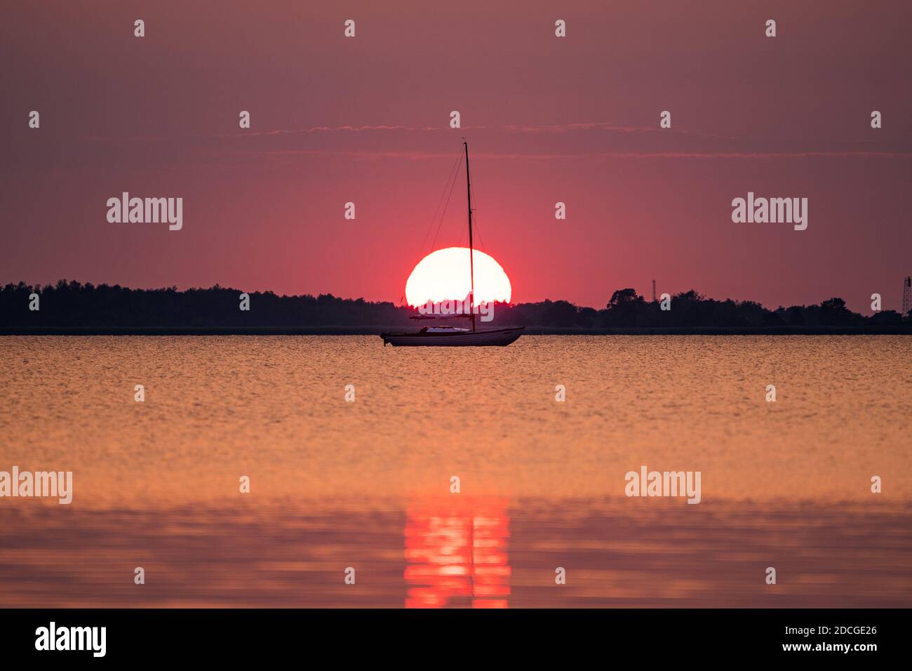 sailboat on the lake during sunset Stock Photo - Alamy