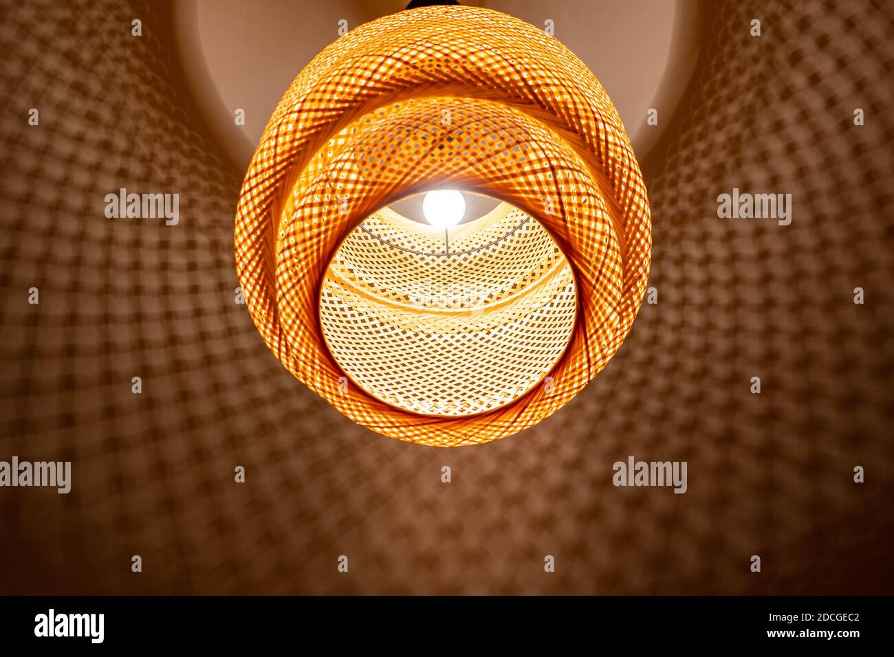 lamp hanging from the ceiling and casting different light and shadow ...