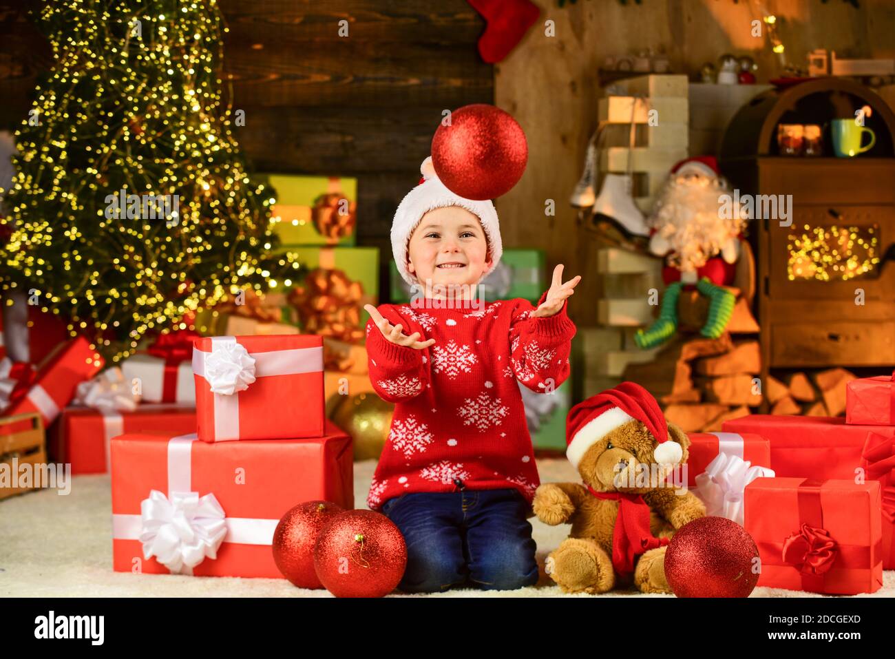 Playful baby boy. Happy child celebrate new year. Little boy play near ...