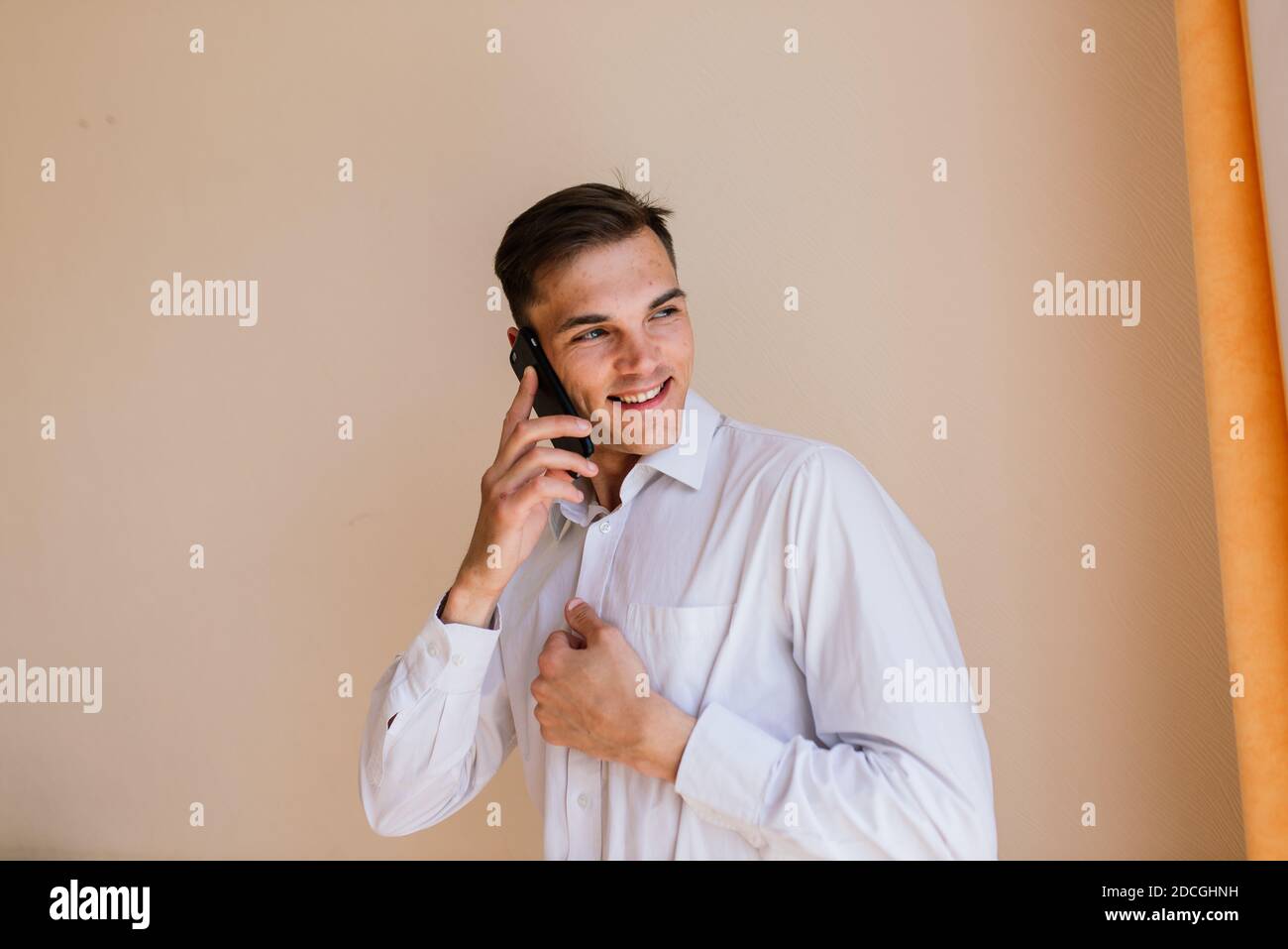 Relaxed young man resting from work. Man enjoy break stretching in home ...